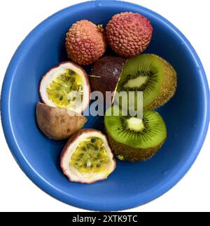 Colorful fruit mix in a ceramic plate. Healthy eating Stock Photo - Alamy