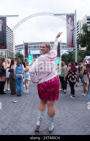 London, 15th August 2024, Swiftie photographing the Taylor Swift ...
