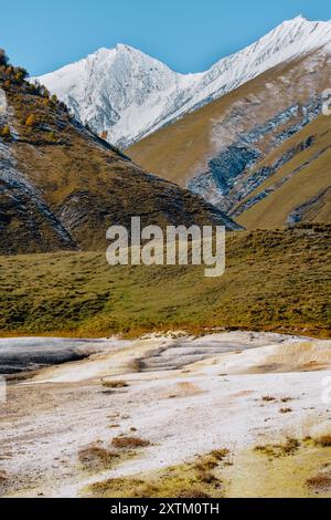 Travertines and snow capped mountains of the Caucasus in the Truso ...
