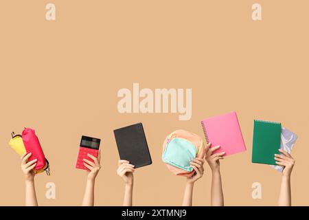 Female hands with different school supplies on pink background Stock ...