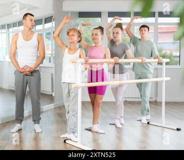 Rehearsal, ballerina and teacher in class, floor and happy for child in ...