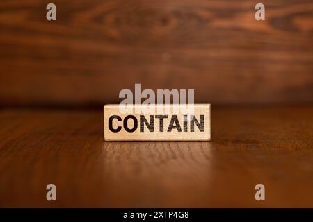 word CONTAIN on wooden block Stock Photo - Alamy