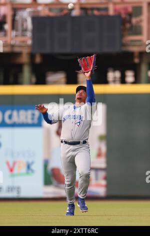 Toronto Blue Jays outfielder Will Robertson plays the ball hit by ...