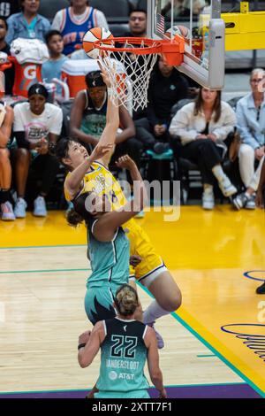 New York Liberty Kennedy Burke dances with the mascot, Ellie the ...