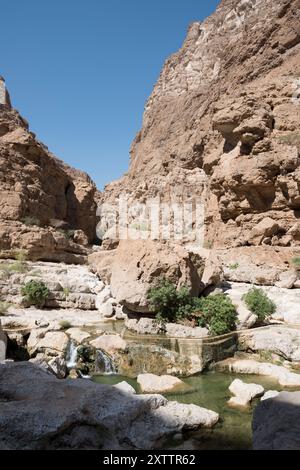 Traditional falaj irrigation system in the mountain village of Misfat ...