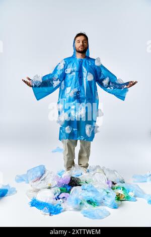 A man stands in a plastic raincoat, surrounded by plastic debris Stock ...