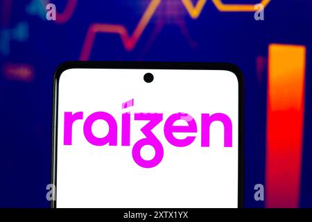 In this photo illustration the Raízen logo seen displayed on a ...