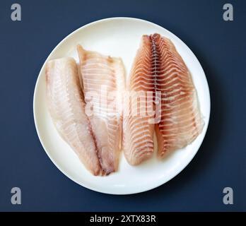 Fillet of tilapia or Saint Peter fish Oreochromis niloticus. Isolated ...