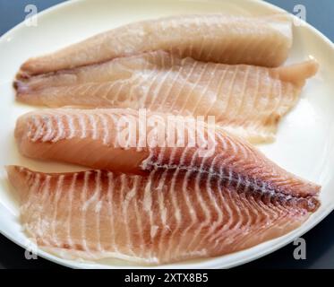 Fillet of tilapia or Saint Peter fish Oreochromis niloticus. Isolated ...