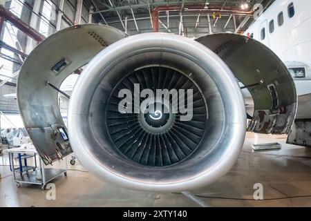 Close-up of an open high-bypass turbofan aircraft engine of a passenger ...