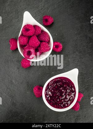 Fresh made Raspberry Jam on a vintage background as detailed close-up ...