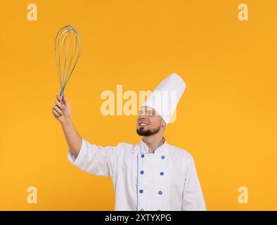 Happy pastry chef with big whisk on pink background. Banner design ...