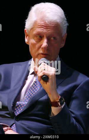 Bill Clinton appears on stage during 'An Evening with the Clintons' at ...