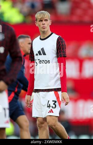 Manchester United midfielder Toby Collyer (43) warms up ahead of the ...