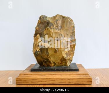 Stone tool. Ancient palaeolithic stone cleaver from the hominid (early ...