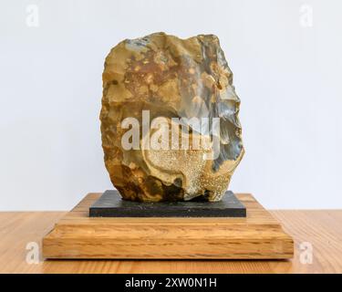 Stone tool. Ancient palaeolithic stone cleaver from the hominid (early ...
