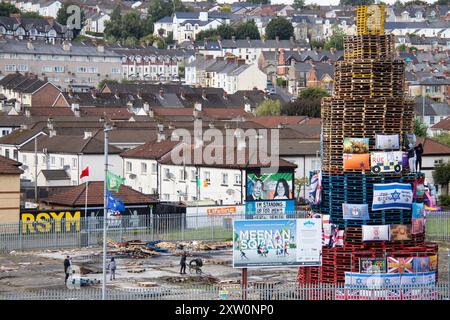 Nationalist youths building the controversial Bonfire in Derry's ...