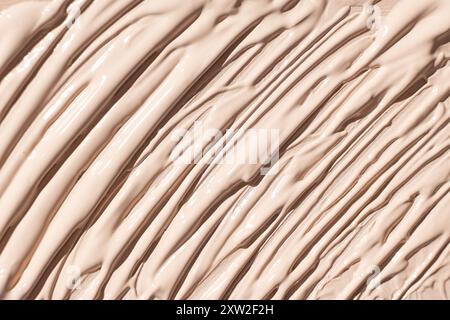 Face foundation texture, beautiful unusual beige abstract background ...