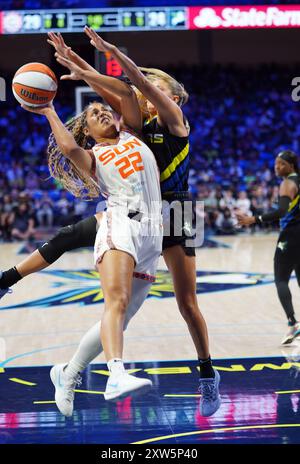 Connecticut Sun guard Jacy Sheldon (4) drives the ball past Washington ...