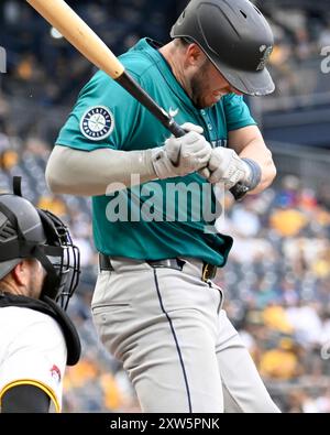 Seattle Mariners' Mitch Garver (18) slides into third base with a ...