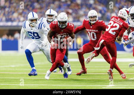 Arizona Cardinals running back Trey Benson (33) runs the ball against ...