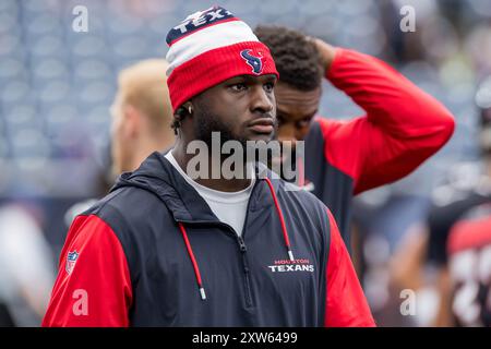 Houston Texans' Will Anderson Jr., left, talks with Detroit Lions ...