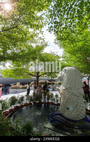 Back view of Merlion cub statue fountain sprouting water, a popular ...