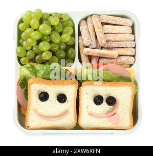Sandwiches with smiley faces and grapes in lunch box isolated on white ...