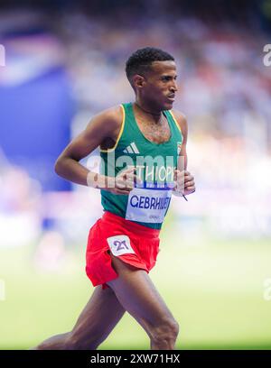 Hagos Gebrhiwet participating in the 5000 meters at the Paris 2024 ...