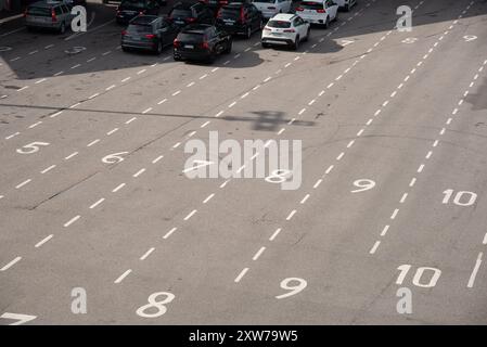 Vehicles in a raw on the port terminal ready for loading in a ferry ...