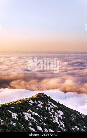 Textures and layers: Montserrat mountain cliff with a sea of clouds and ...