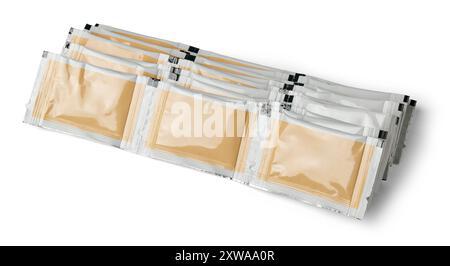 strips of blank foil sachet packets isolated gray background, close-up ...