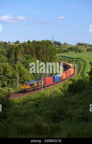 GB Rail Freight 66 diesel locomotive on the west coast main line with ...