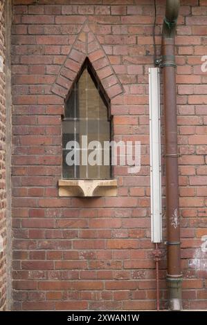 Small church window with downpipe and lightning conductor cable Stock ...