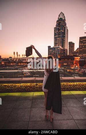 College Graduation Portraits on Rooftop Downtown Stock Photo - Alamy