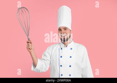 Happy pastry chef with big whisk on pink background. Banner design ...