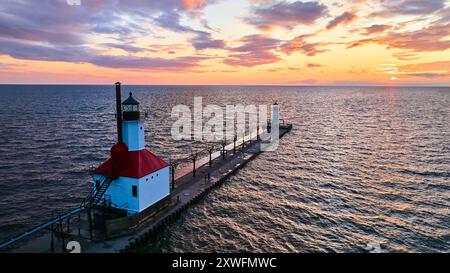 Aerial View of Sunset Over Twin Lighthouses and Pier on Lake Michigan ...