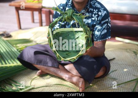 Fijian traditional basket weaving from palm leaves, men's basket ...