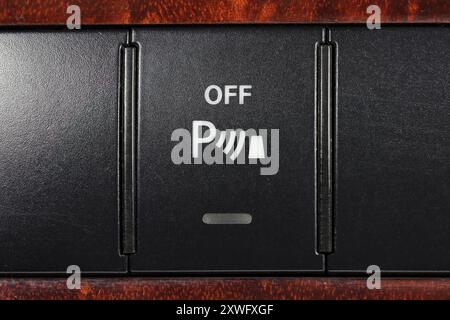 parking sensors deactivation switch inside a used car Stock Photo - Alamy
