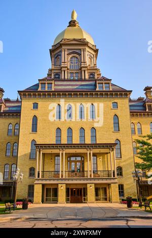 Historic University Building with Golden Dome and Pathway Perspective ...