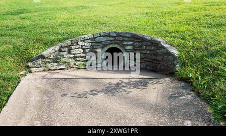 Drainage culvert surrounded by grass to help drain small property ...