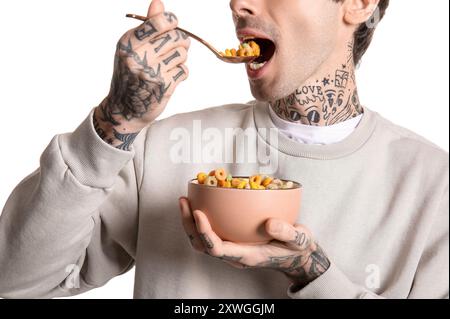 Man eating cereal rings on white background Stock Photo - Alamy