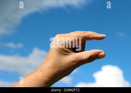 hand signal with thumb and index finger Stock Photo - Alamy