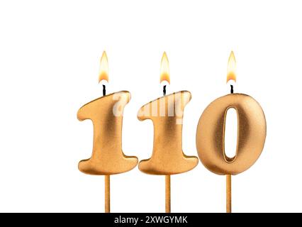 Golden number 110 birthday candle on white background Stock Photo - Alamy