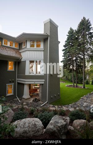 Side of house showing tower and dry stream drainage area and backyard ...