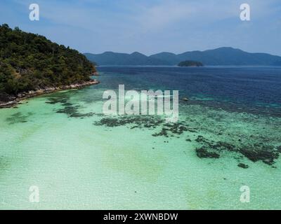 Aerial view of Koh Ra Wi, its beautiful coral reefs and turquoise water ...