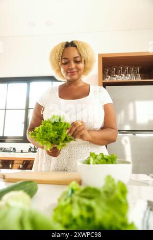 Young african american plus size woman over grey grunge wall wearing ...