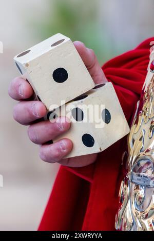 Close of man hand holding cube figure as symbol of innovation. Mixed ...