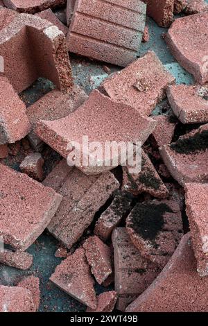 A mess at a construction site with scattered building materials and ...