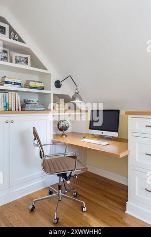 Corner built-in desk in remodeled second floor home office Stock Photo ...